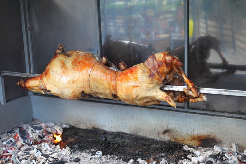 Roasted lamb on the spit stock image. Image of greasy - 38324121