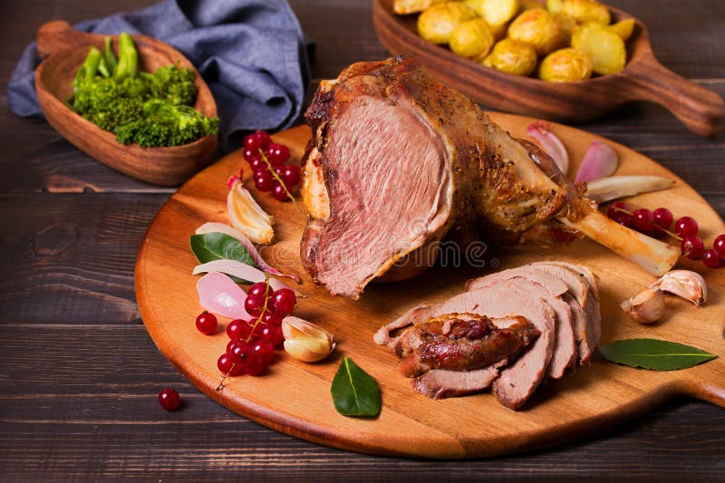 Roasted Leg of Lamb on Serving Board. Stock Photo - Image of grilled ...
