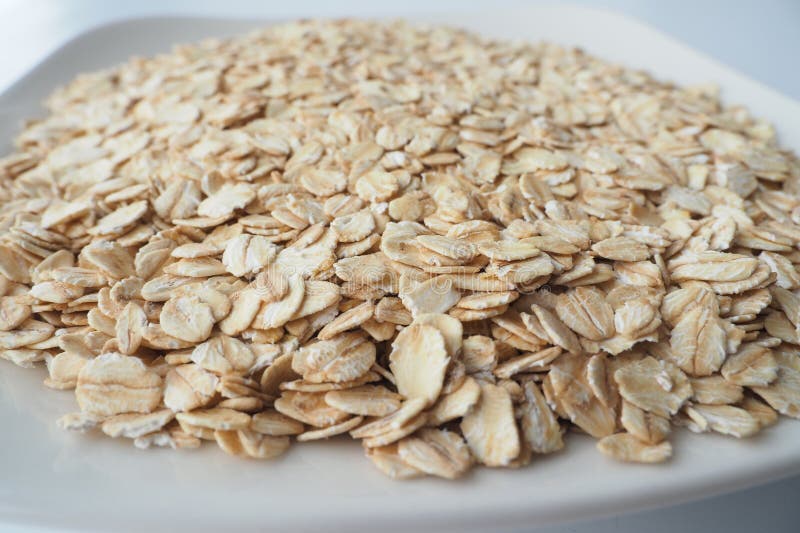 Roasted Oats Flakes on a White Plate Stock Image - Image of meal ...