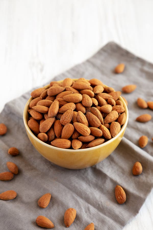 Roasted Organic Almonds in a Bowl, Side View Stock Photo - Image of ...