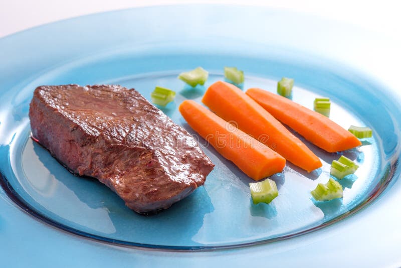 Roasted Ostrich Meat with Carrots and Celery Stock Photo - Image of ...
