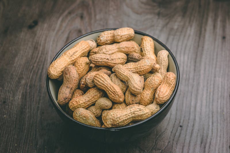 Roasted Peanuts Inside a Black Bowl on Top of a Table Stock Photo ...