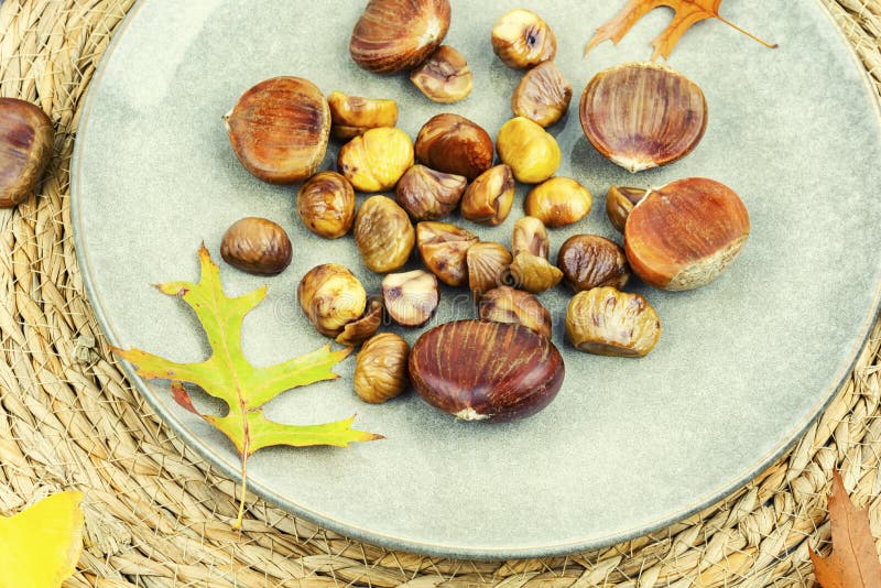 Roasted peeled chestnuts stock photo. Image of autumn - 259634476