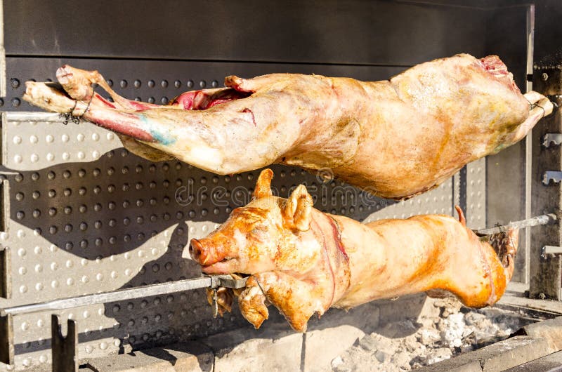 Roasted Pig and Lamb on the Rack Stock Photo - Image of meat, food ...