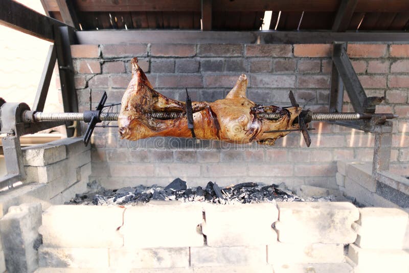 Roasted pig on spit stock photo. Image of lunch, feast - 88695448