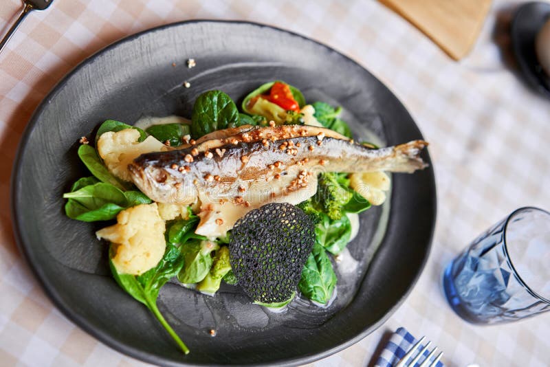 Roasted Pike Perch or Cod Fish with Baked Vegetables and Spinach. Dish ...