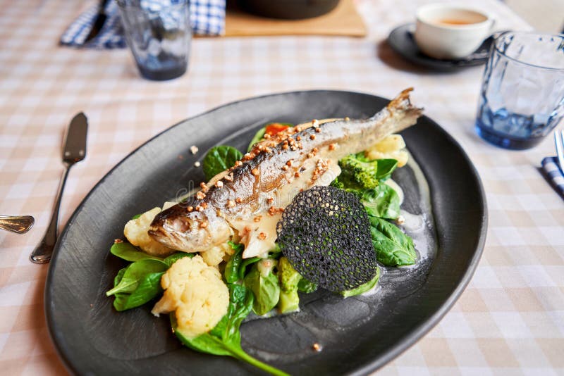 Roasted Pike Perch or Cod Fish with Baked Vegetables and Spinach. Dish ...