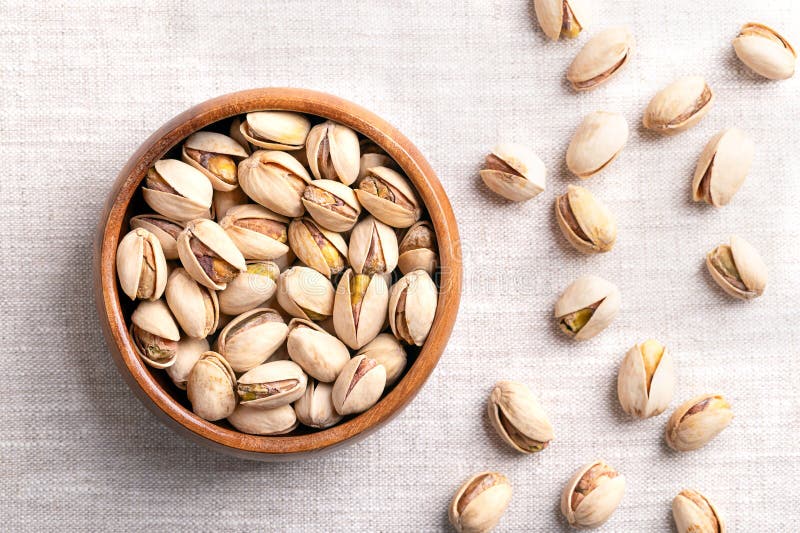 Pistachios in Their Shells, Roasted and Salted, in a Wooden Bowl on ...