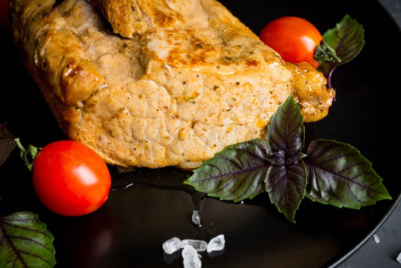 Roasted Pork on the Black Plate Stock Image - Image of natural, evening ...