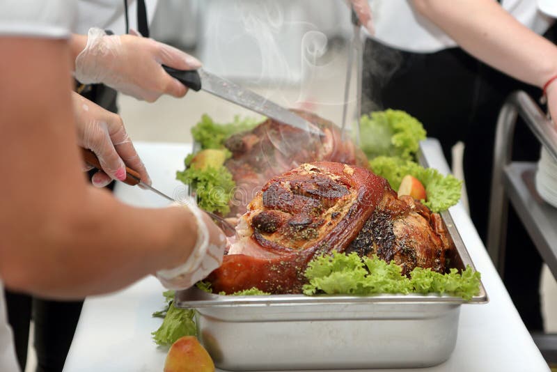Roasted Pork Ham at the Party or Wedding Reception Waiter Serves Stock ...