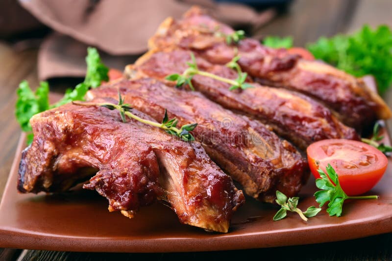Roasted pork ribs on plate stock photo. Image of roasted - 60898908