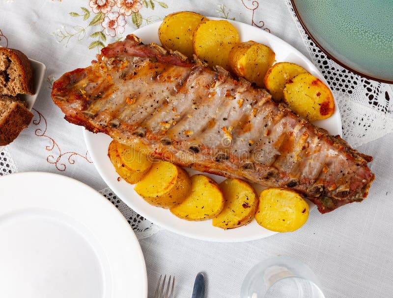 Roasted Pork Ribs with Side Dish of Fried Potatoes Stock Image - Image ...