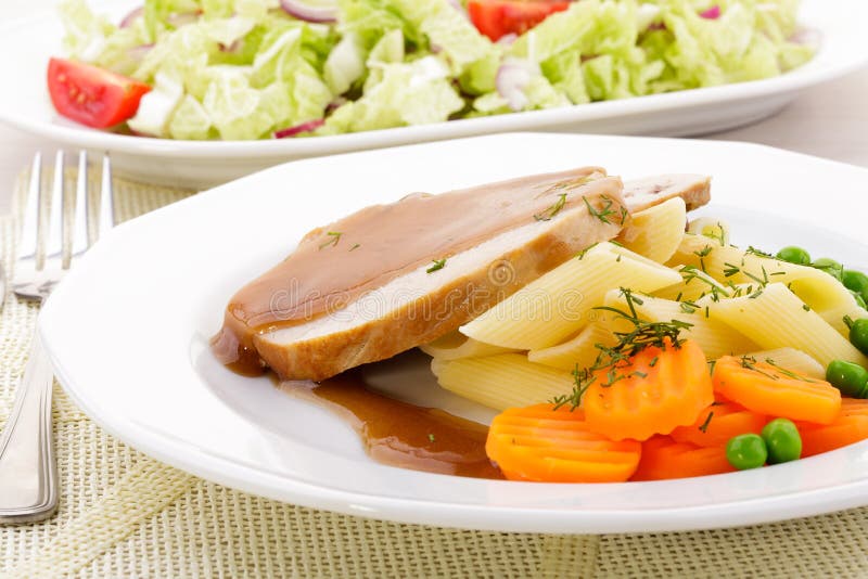 Roasted Pork Shoulder Served with Pasta and Vegetables Stock Photo ...