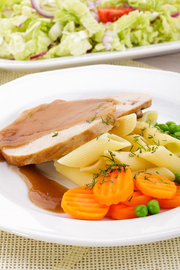 Roasted Pork Shoulder Served with Pasta and Vegetables Stock Image ...