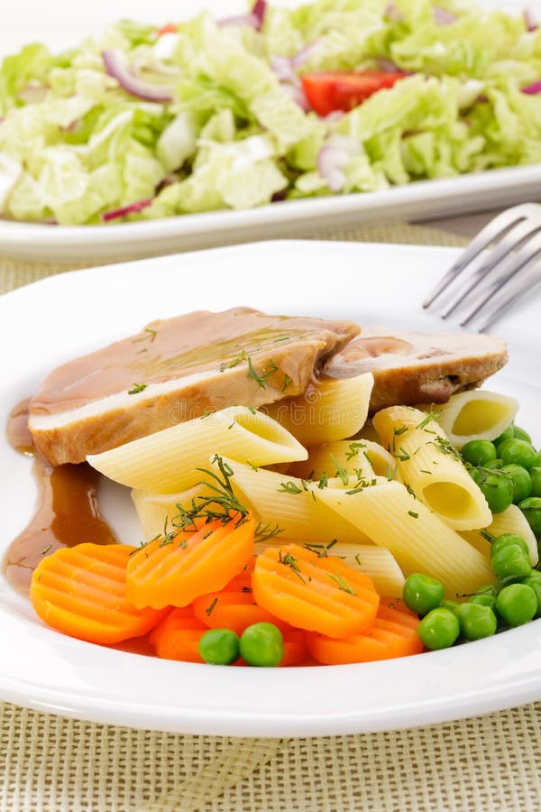 Roasted Pork Shoulder Served with Pasta and Vegetables Stock Photo ...