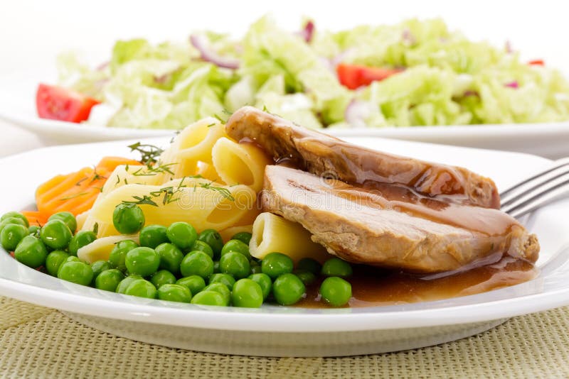 Roasted Pork Shoulder Served with Pasta and Vegetables Stock Image ...