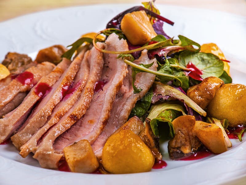 Roasted Pork on White Plate Stock Photo - Image of dinner, cooking ...