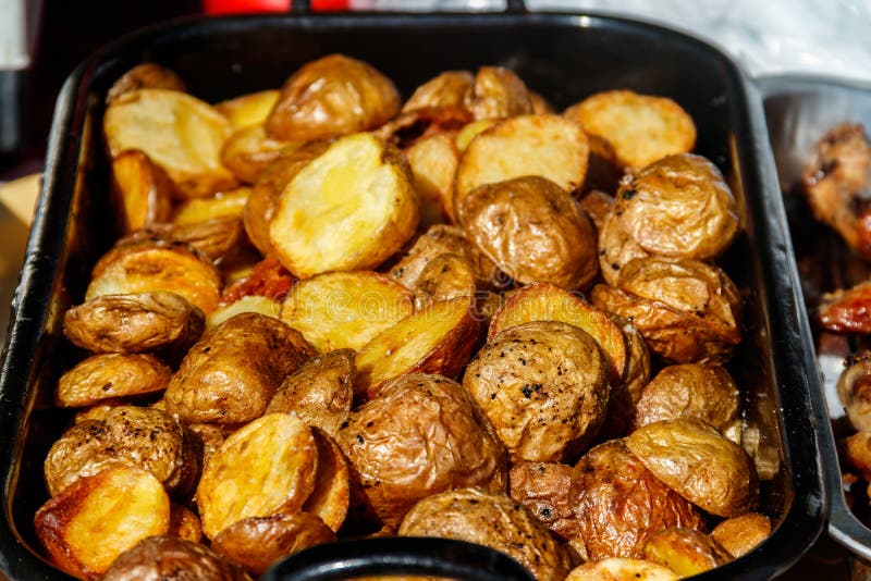 Roasted potatoes in tray stock image. Image of appetizer - 147869245