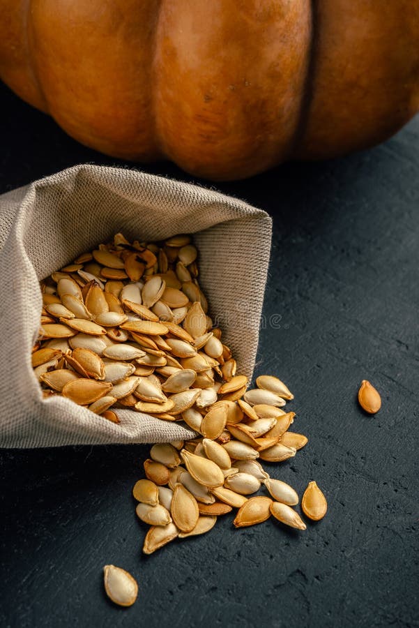 Roasted Pumpkin Seeds in Cotton Bag on Black Background Stock Image ...