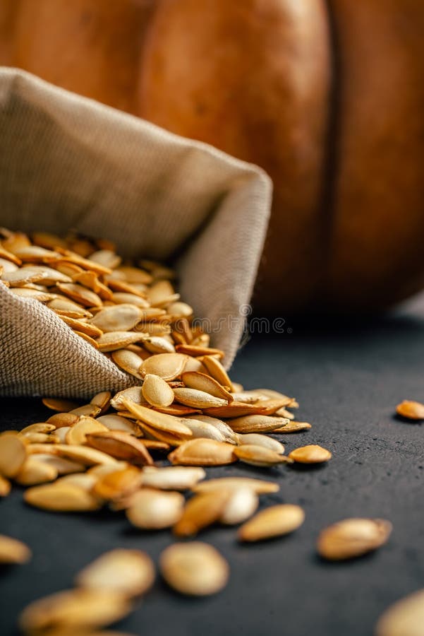 Roasted Pumpkin Seeds in Cotton Bag on Black Background Stock Image ...