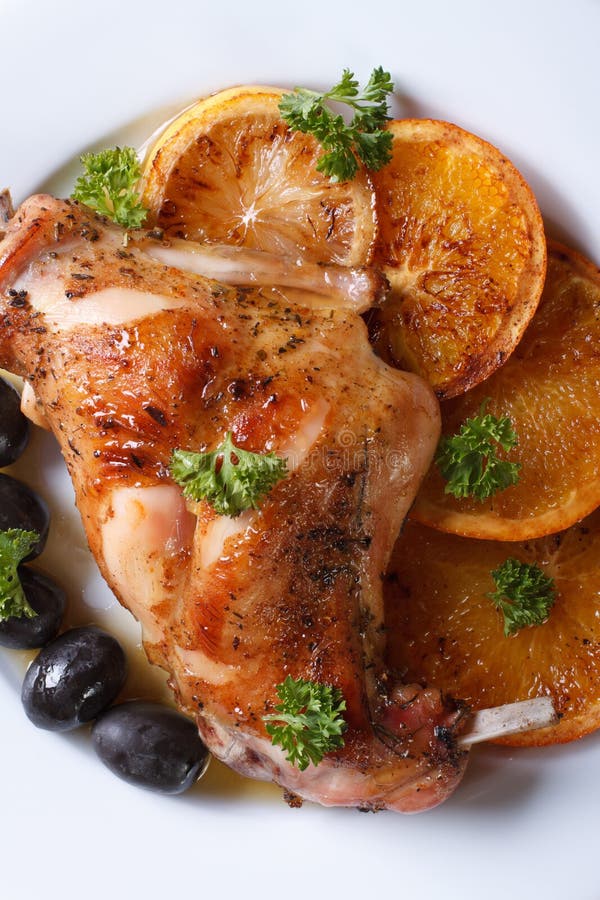 Roasted Rabbit Leg with Peppers and Olives Top View Horizontal Stock ...