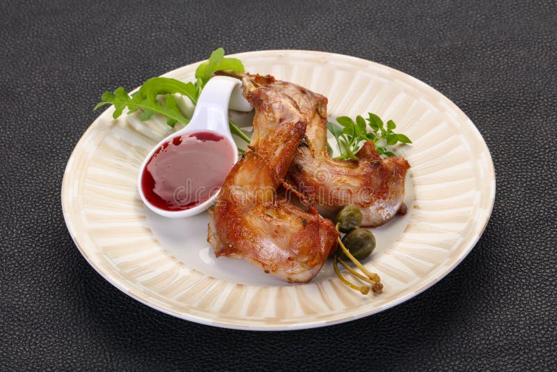 Roasted rabbit legs stock photo. Image of grilled, meal - 159753110