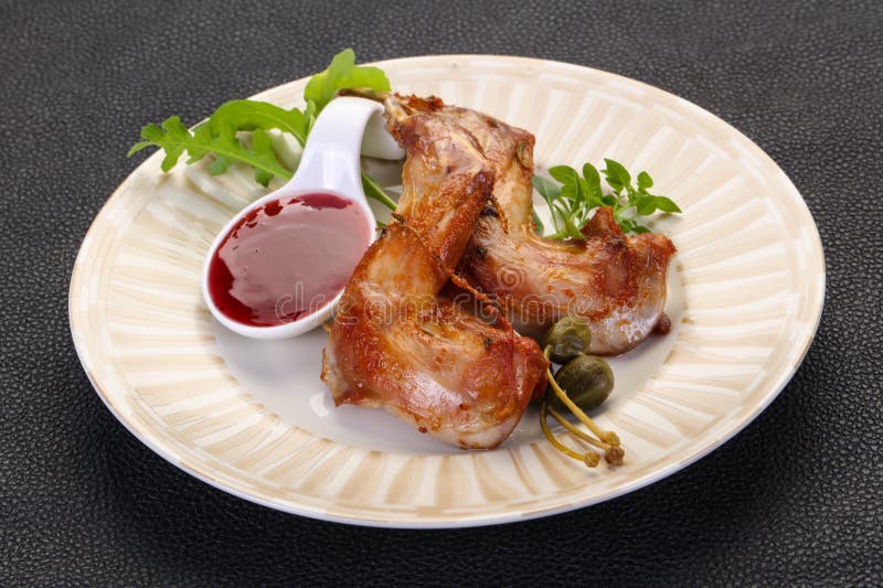 Roasted rabbit legs stock image. Image of portion, dish - 142490495