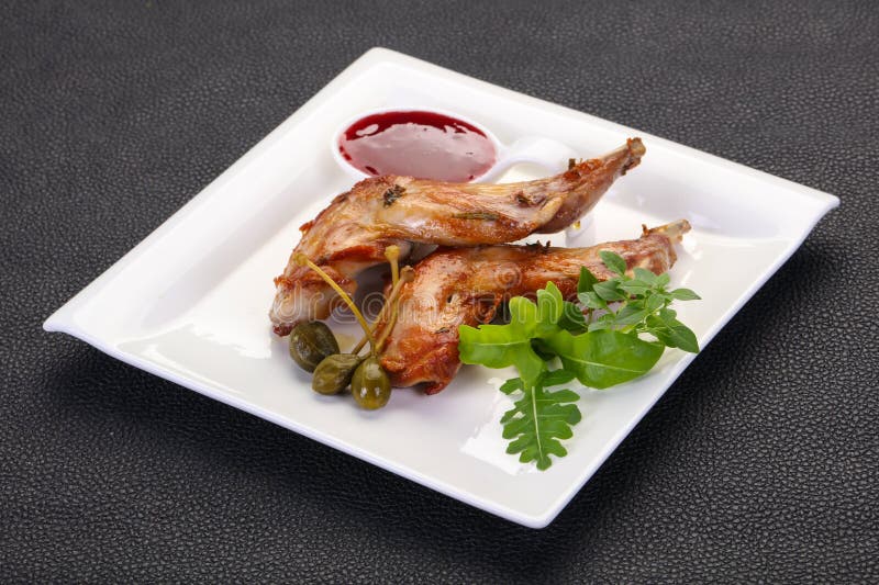 Roasted rabbit legs stock photo. Image of gourmet, baked - 156589538