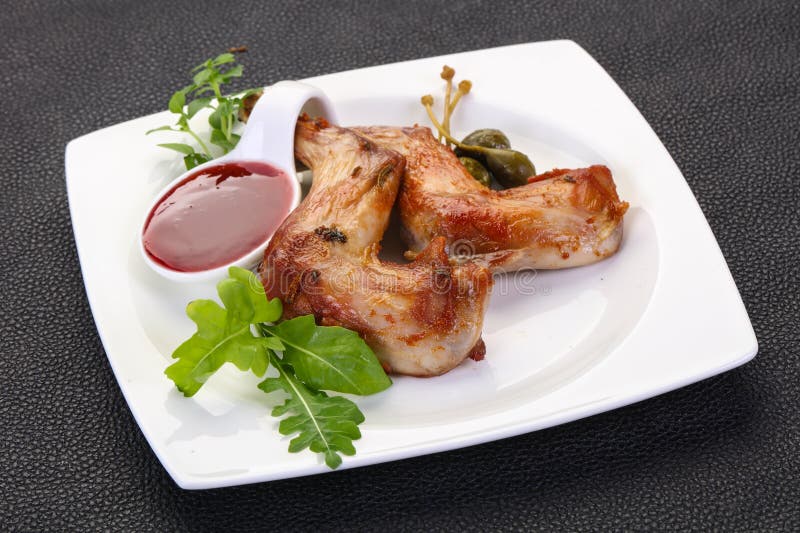Roasted rabbit legs stock photo. Image of meal, delicious - 180415602