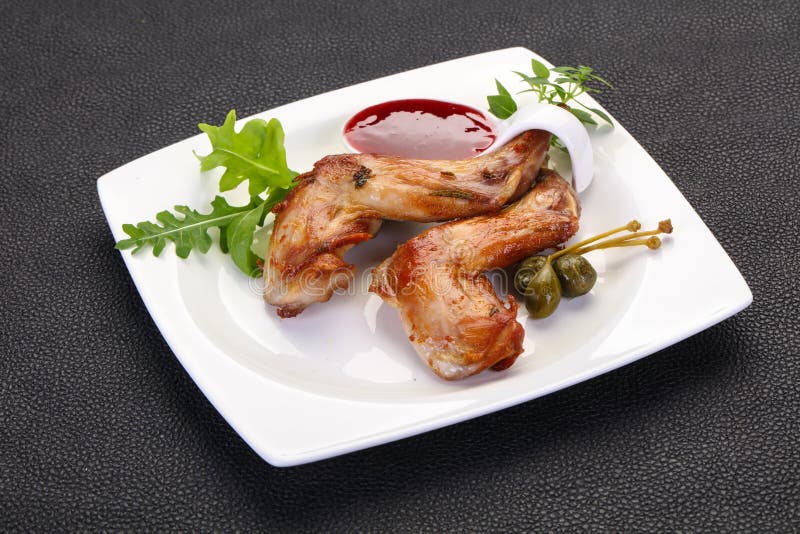 Roasted rabbit legs stock photo. Image of dinner, grilled - 192226868