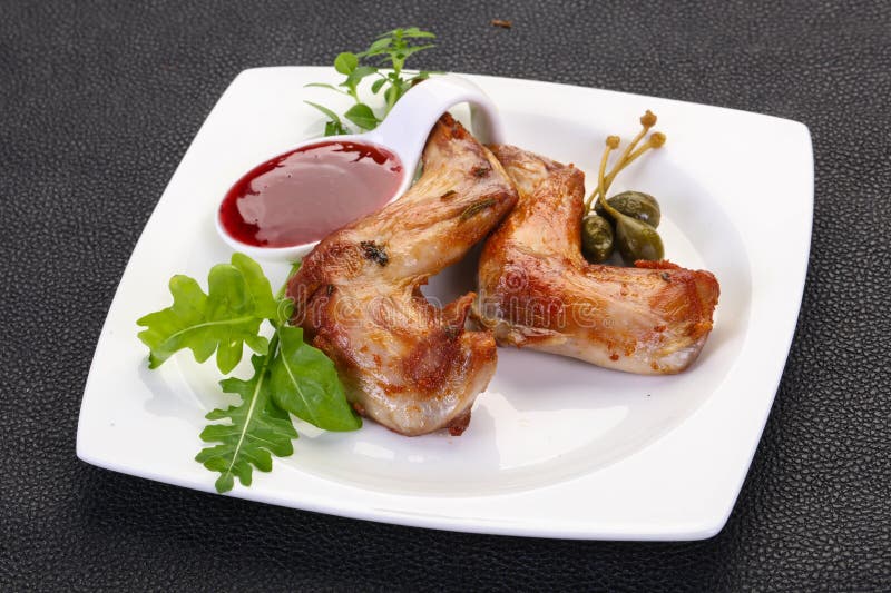 Roasted rabbit legs stock photo. Image of grilled, meal - 197684556