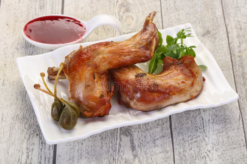 Roasted rabbit legs stock image. Image of meal, delicious - 208471723