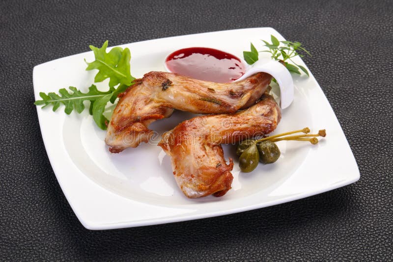 Roasted rabbit legs stock photo. Image of cuisine, cooking - 209174150