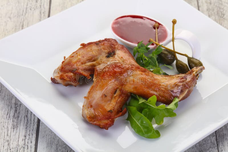 Roasted rabbit legs stock photo. Image of game, cooked - 209370566
