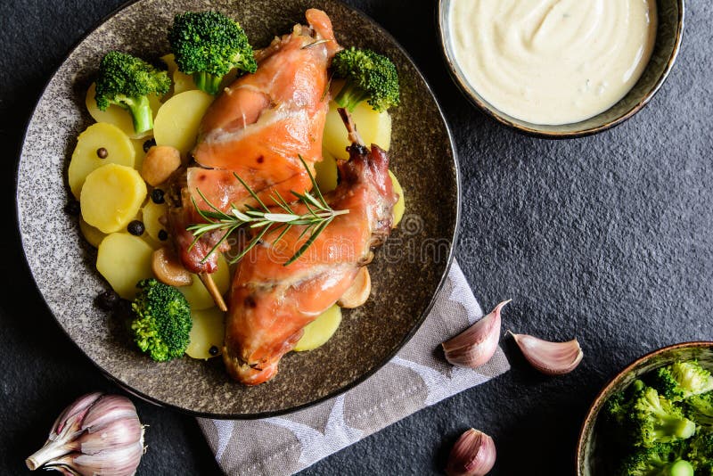Roasted Rabbit Meat with Potato and Broccoli Stock Photo - Image of ...