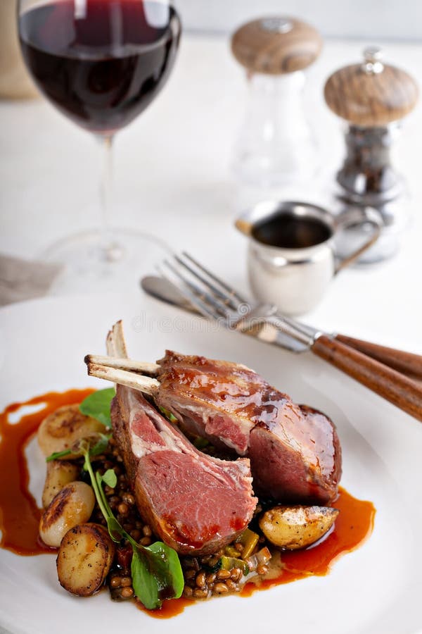 Roasted rack of lamb stock photo. Image of bone, gastronomy - 174685244