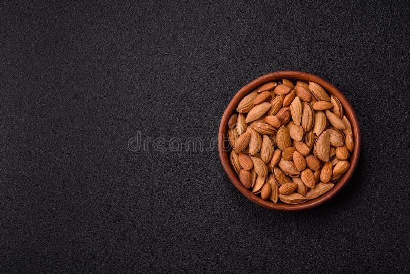 Roasted or Raw Almond Nuts in Shell in Bowl Stock Photo - Image of ...