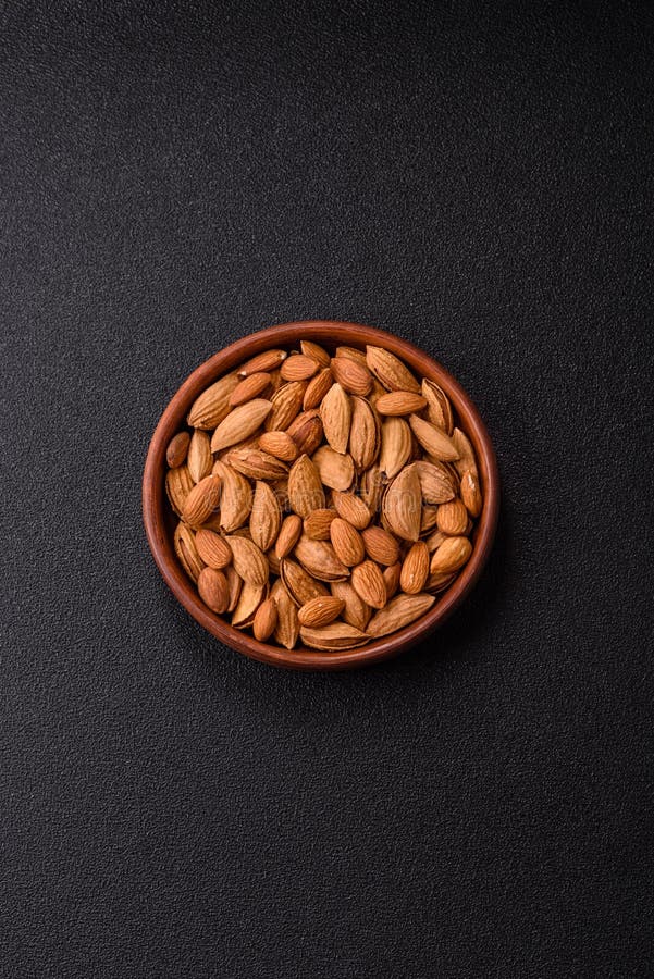 Roasted or Raw Almond Nuts in Shell in Bowl Stock Photo - Image of ...
