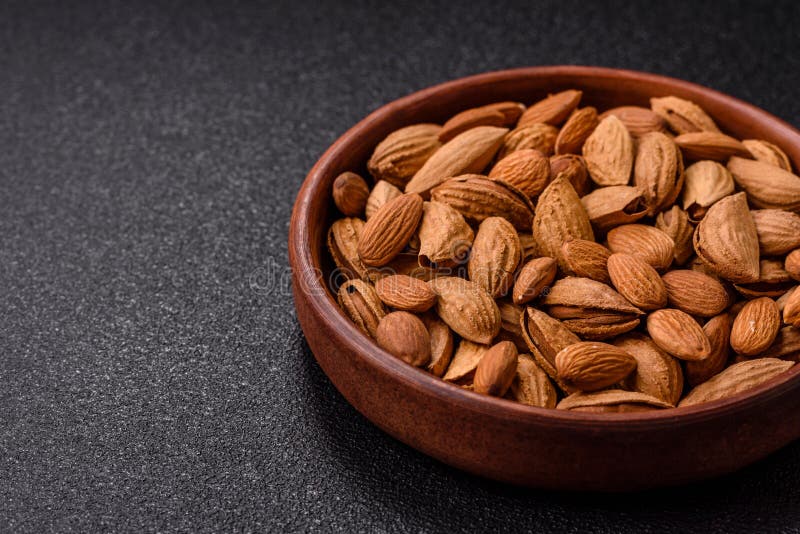 Roasted or Raw Almond Nuts in Shell in Bowl Stock Photo - Image of ...