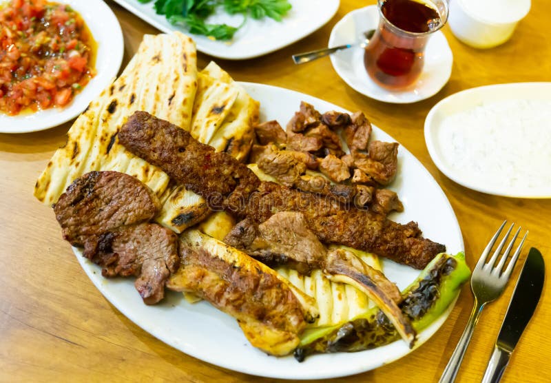 Roasted Red Meat Served on Plate with Flatbread Stock Photo - Image of ...