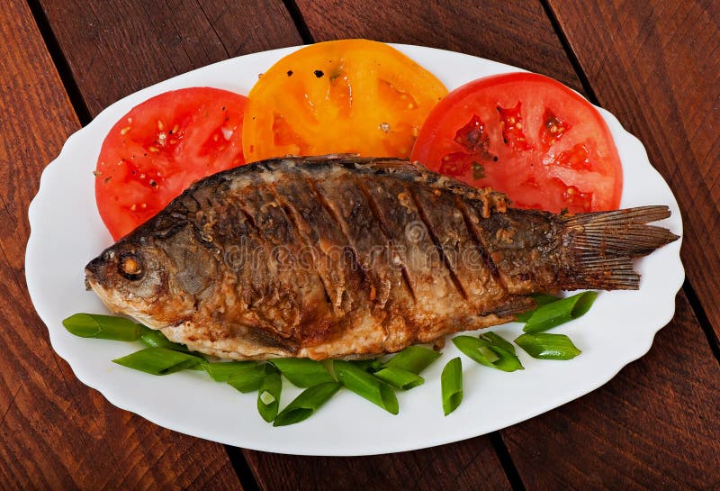 Roasted River Fish Carp on a White Plate Stock Image - Image of tomato ...