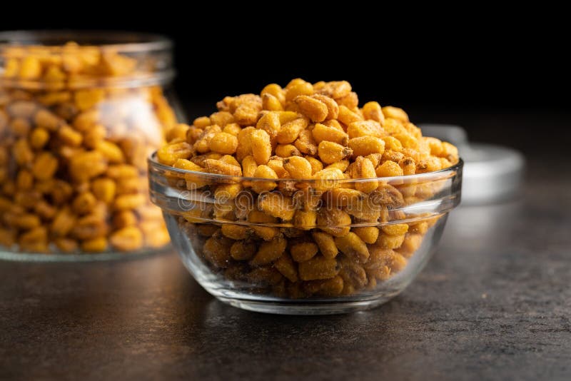 Roasted Salted Corn Snack in Bowl on Black Table Stock Photo - Image of ...