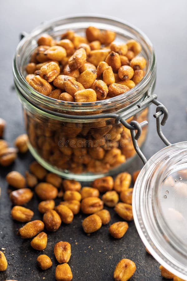 Roasted Salted Corn Snack in Jar on Black Table Stock Photo - Image of ...