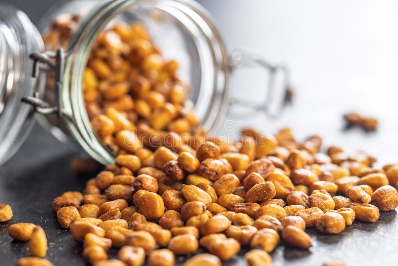 Roasted Salted Corn Snack in Jar on Black Table Stock Photo - Image of ...