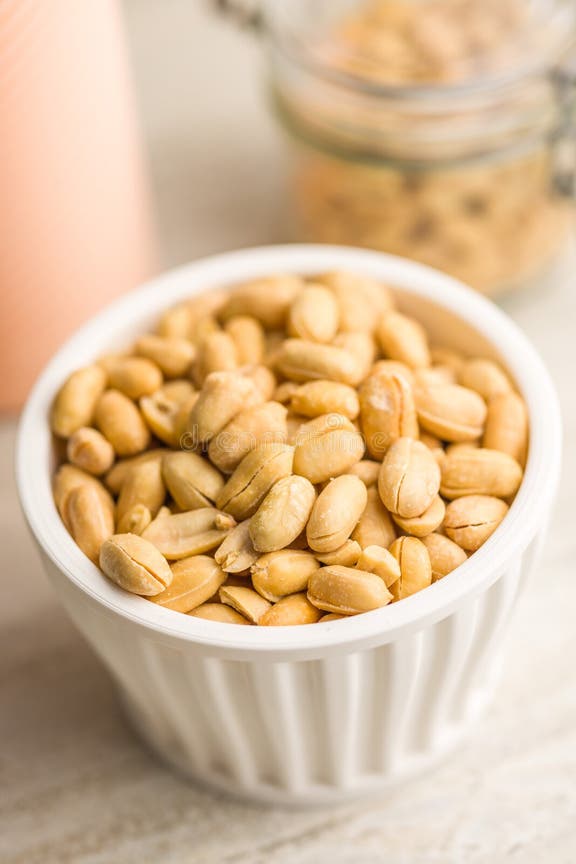 Roasted Salted Peanuts in Bowl on Kitchen Table Stock Image - Image of ...