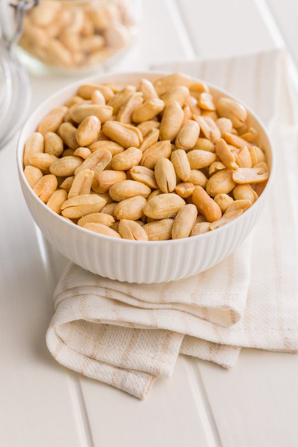 Roasted Salted Peanuts in Bowl on White Table Stock Image - Image of ...
