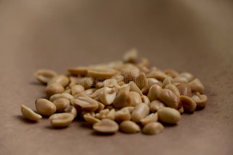 Roasted, Salted Peanuts on Brown Paper Stock Image - Image of paper ...