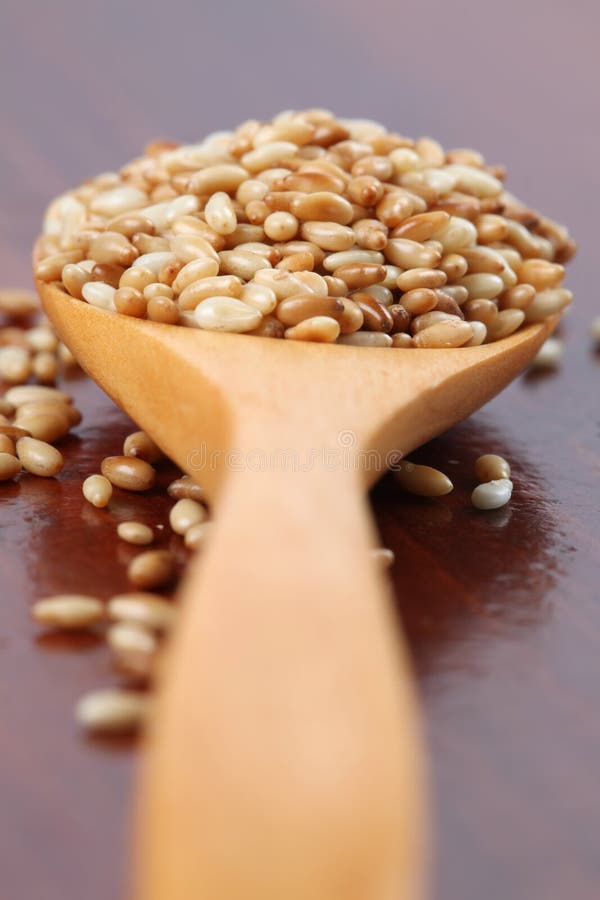 Roasted sesame seeds stock image. Image of spoonful, spoon - 15378345