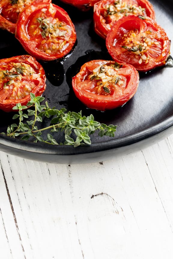 Roasted Tomatoes with Garlic and Thyme Stock Image - Image of herbs ...