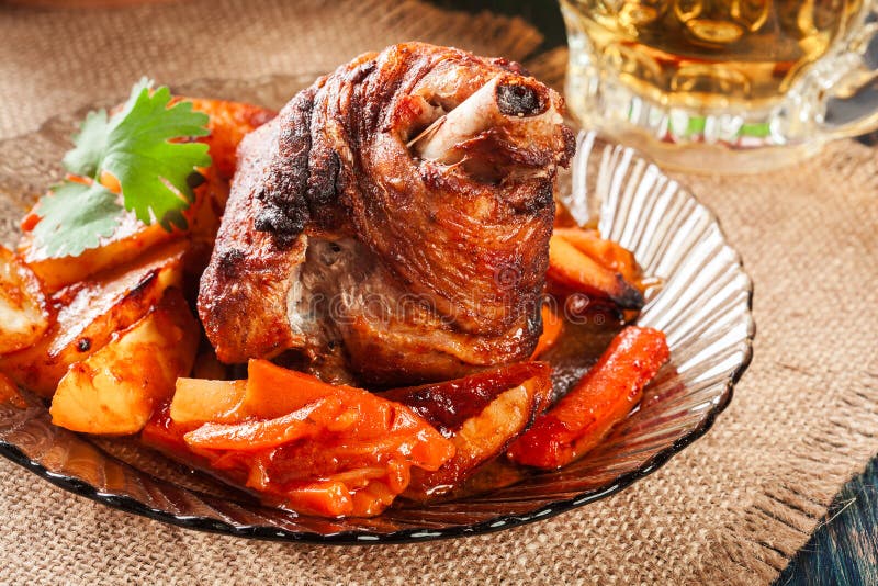 Roasted Turkey Knuckle with Potatoes and Vegetable Stock Image - Image ...